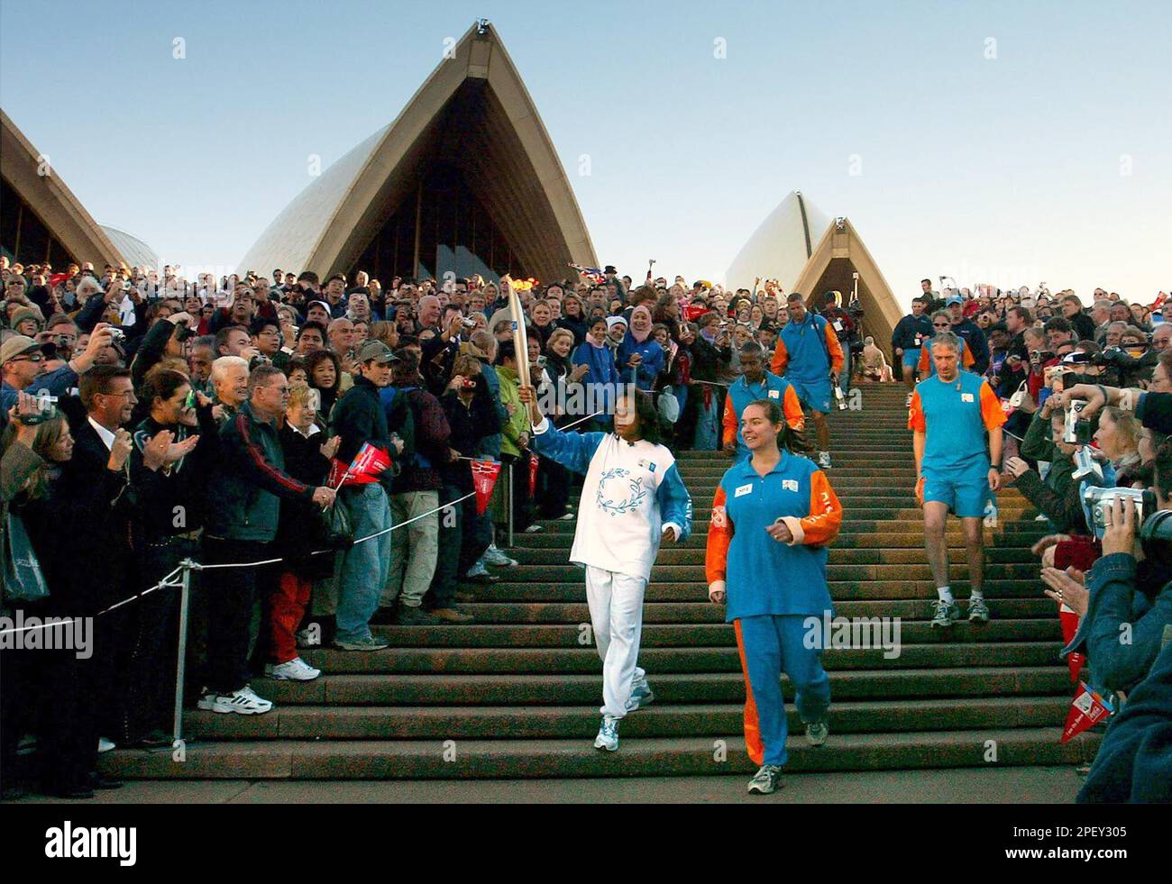Australia's Olympic champion Cathy Freeman holds the Olympic torch ...