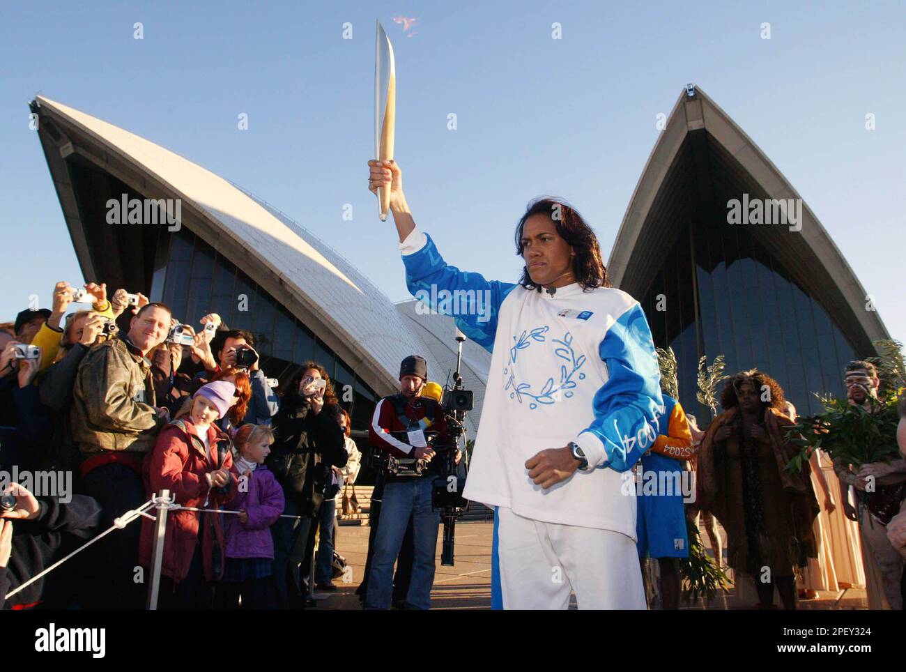 Australia's Olympic champion Cathy Freeman holds the Olympic torch ...