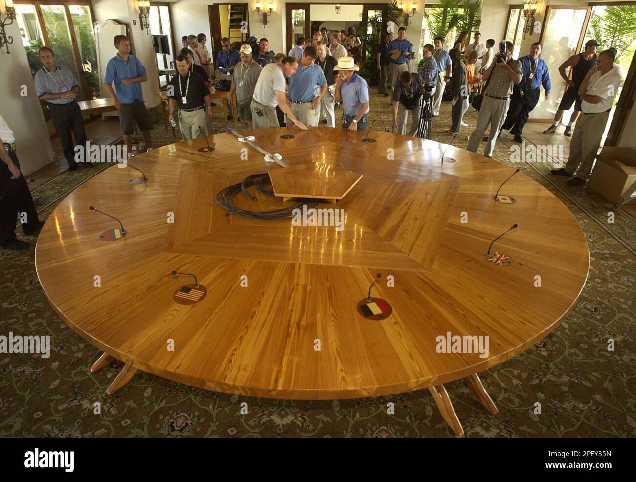 Members of the media, construction workers and craftsmen gather ...