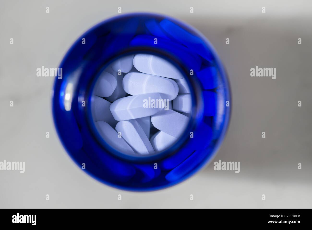 Top View in White Pills Calcium Of Medicines in Bottle Against white ...