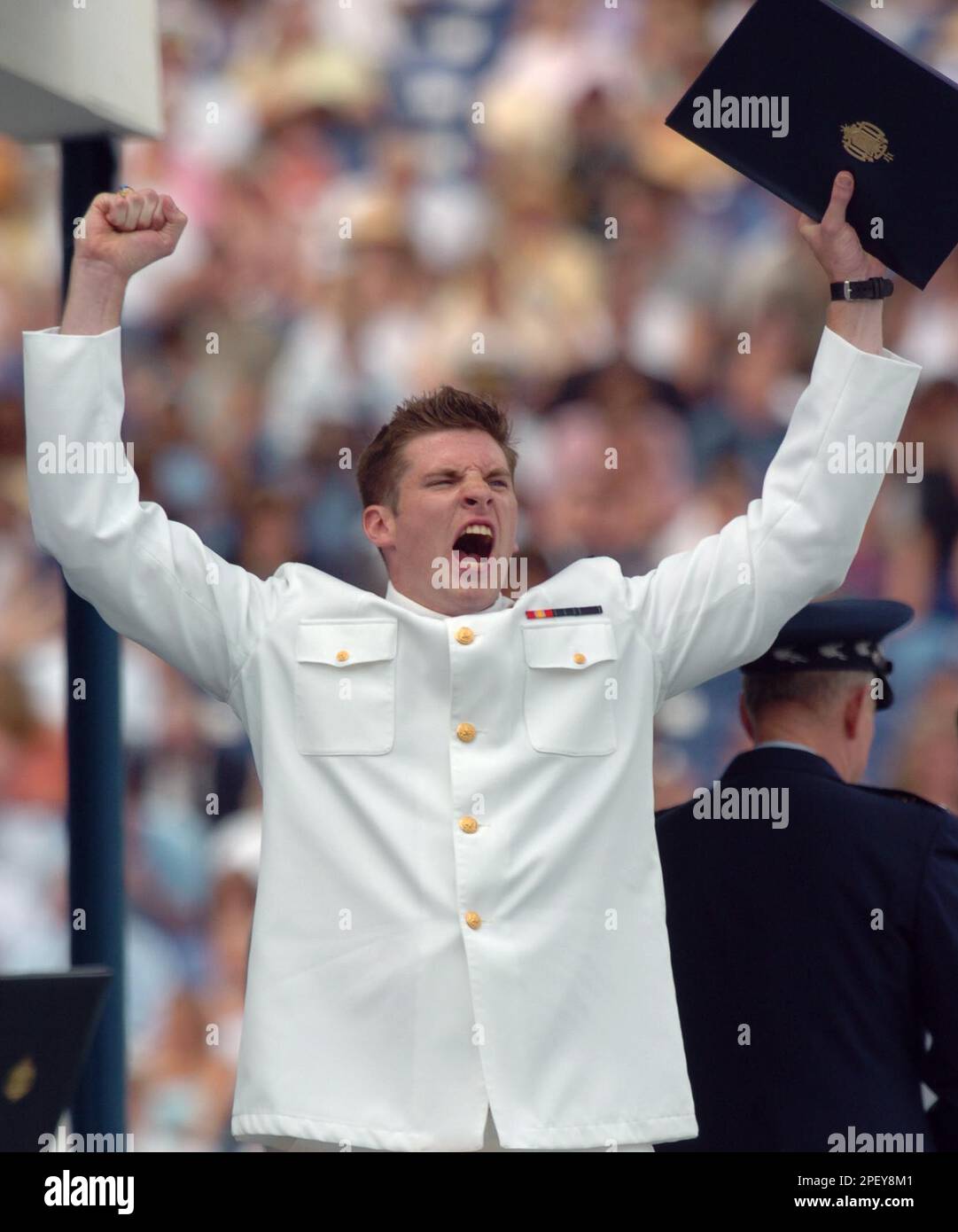 Benjamin David Hartly rejoices after receiving his diploma from the U.S ...