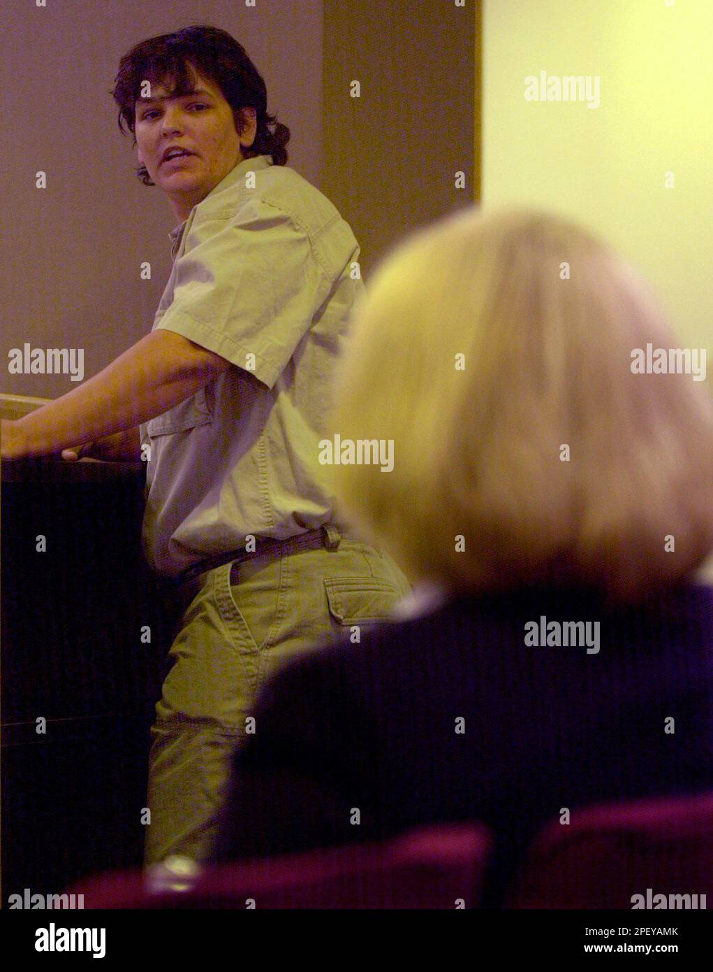 Department of Corrections officer Lois Fraley, left, looks back at ...