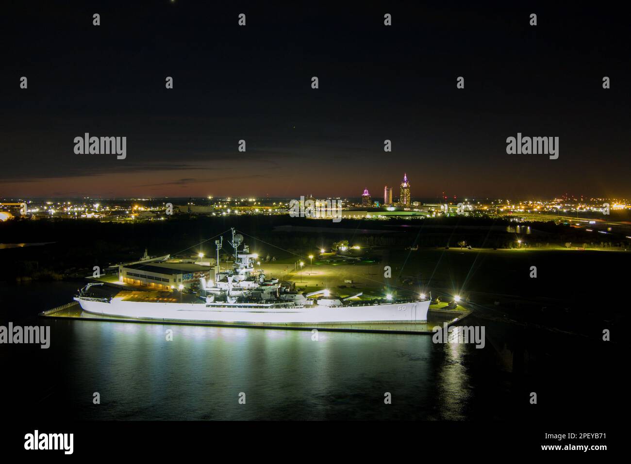 The USS Alabama battleship at night Stock Photo - Alamy