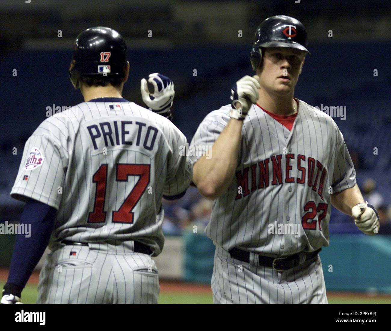 Minnesota Twins' Justin Morneau (27) celebrates with teammate Alex ...