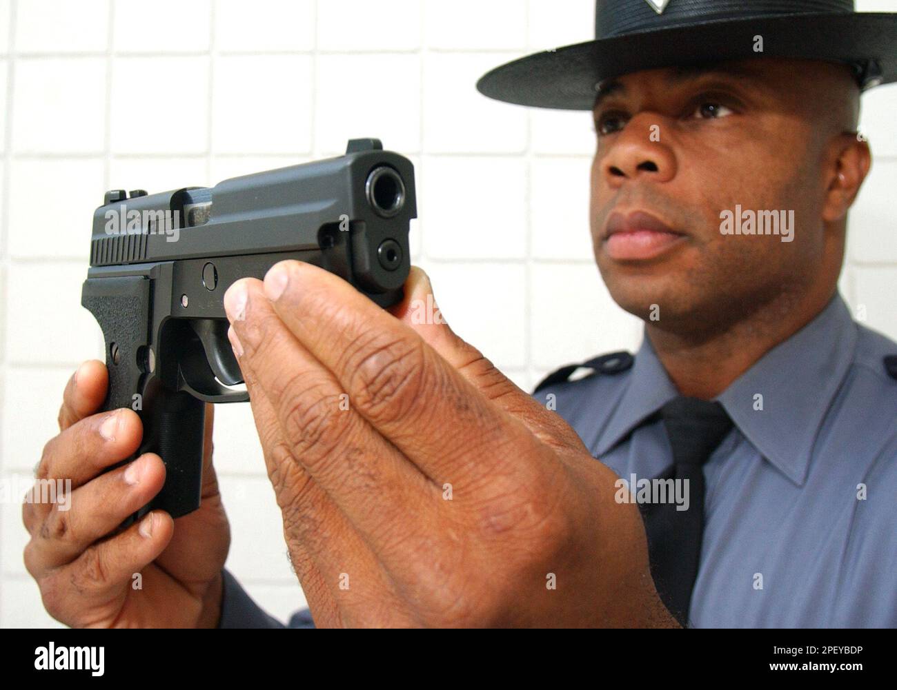 Senior State Police Trooper Gary Crawley holds a new Sig Sauer .357 ...