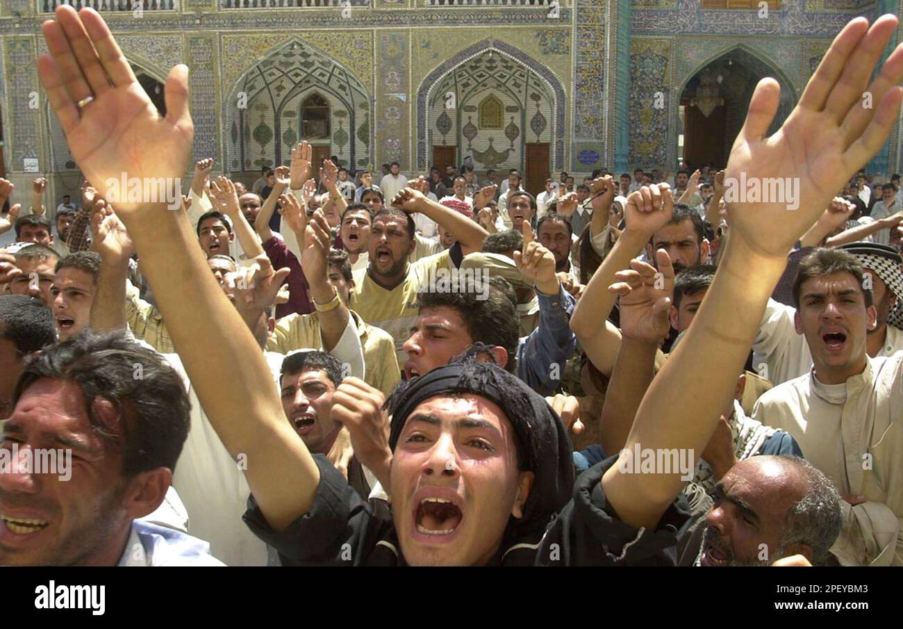 Iraqis gesture as they arrive at the holy shrine of Shia Islam, after ...