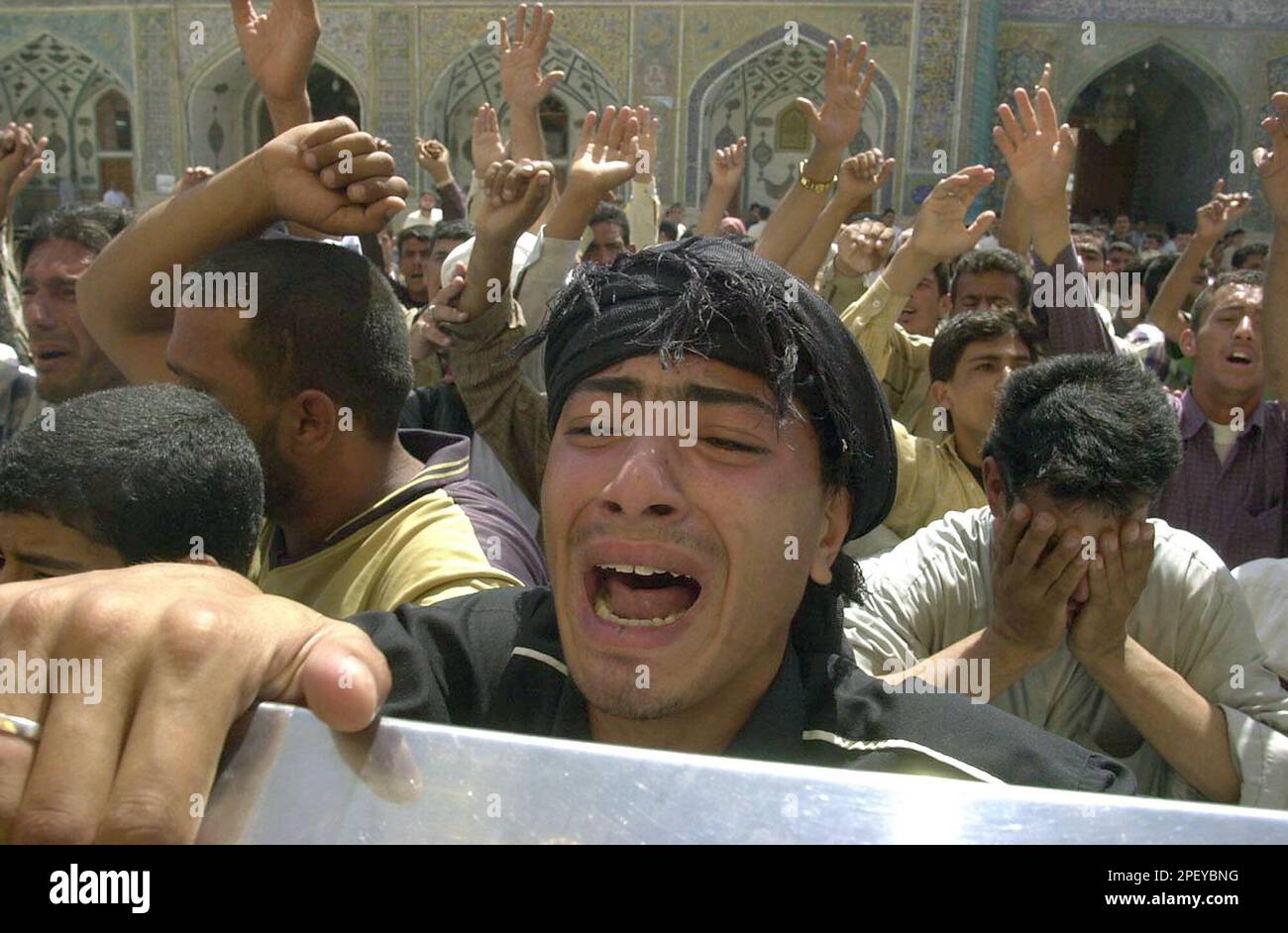 Iraqis arrive to the holy shrine of Shia Islam, after clashes broke out ...