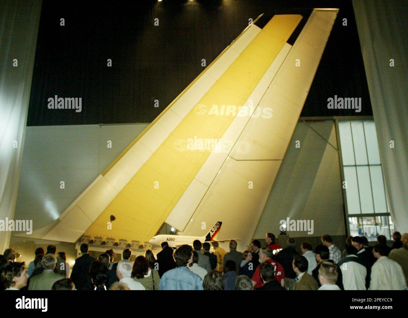 Airbus workers and guests look at the first 14 meter (46 feet) tall ...