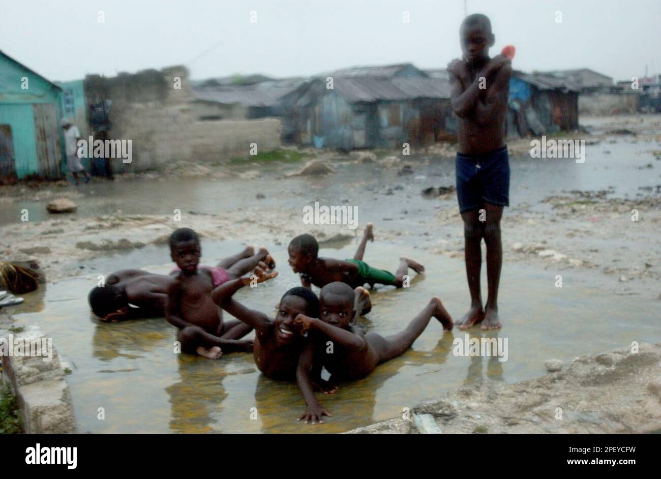 A group of children play in the seaside slum of Cite du Solei, Port-au ...