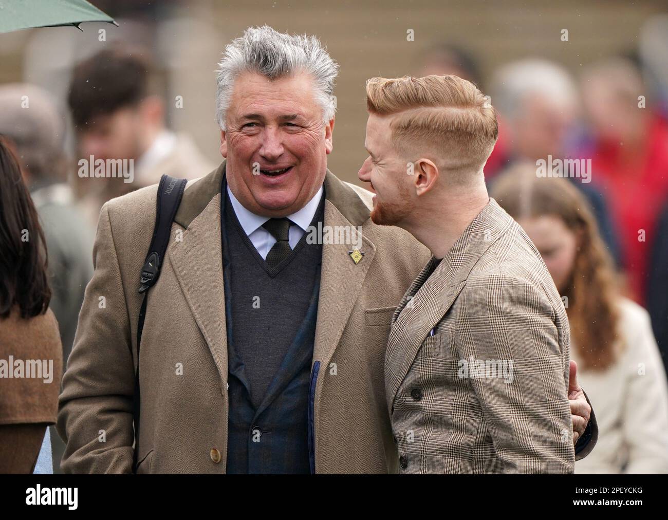 Trainer Paul Nicholls and Mikey North watching the Ryanair Chase on day ...