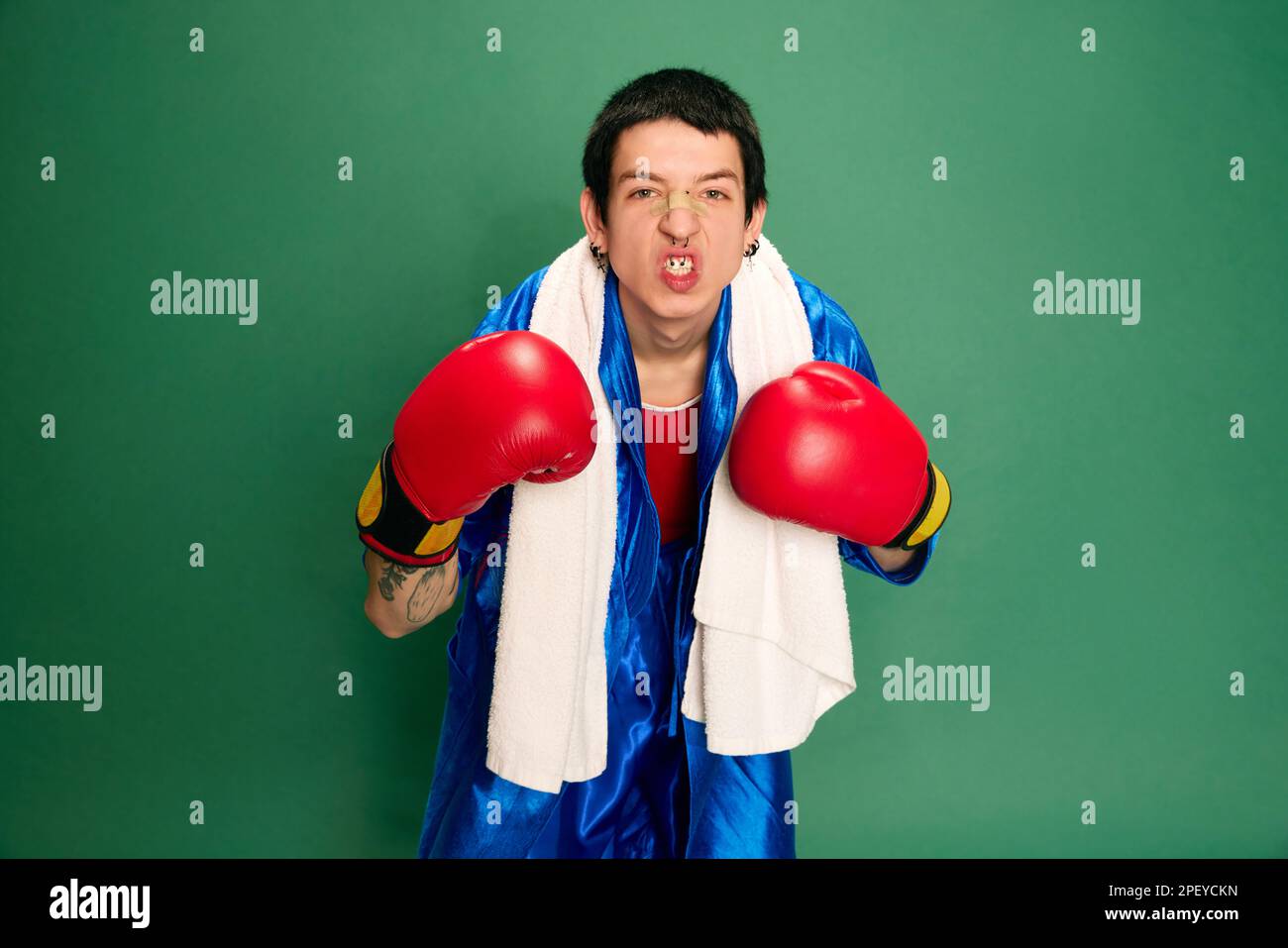 Portrait of aggressive boxer ready to punching and showing strength ...