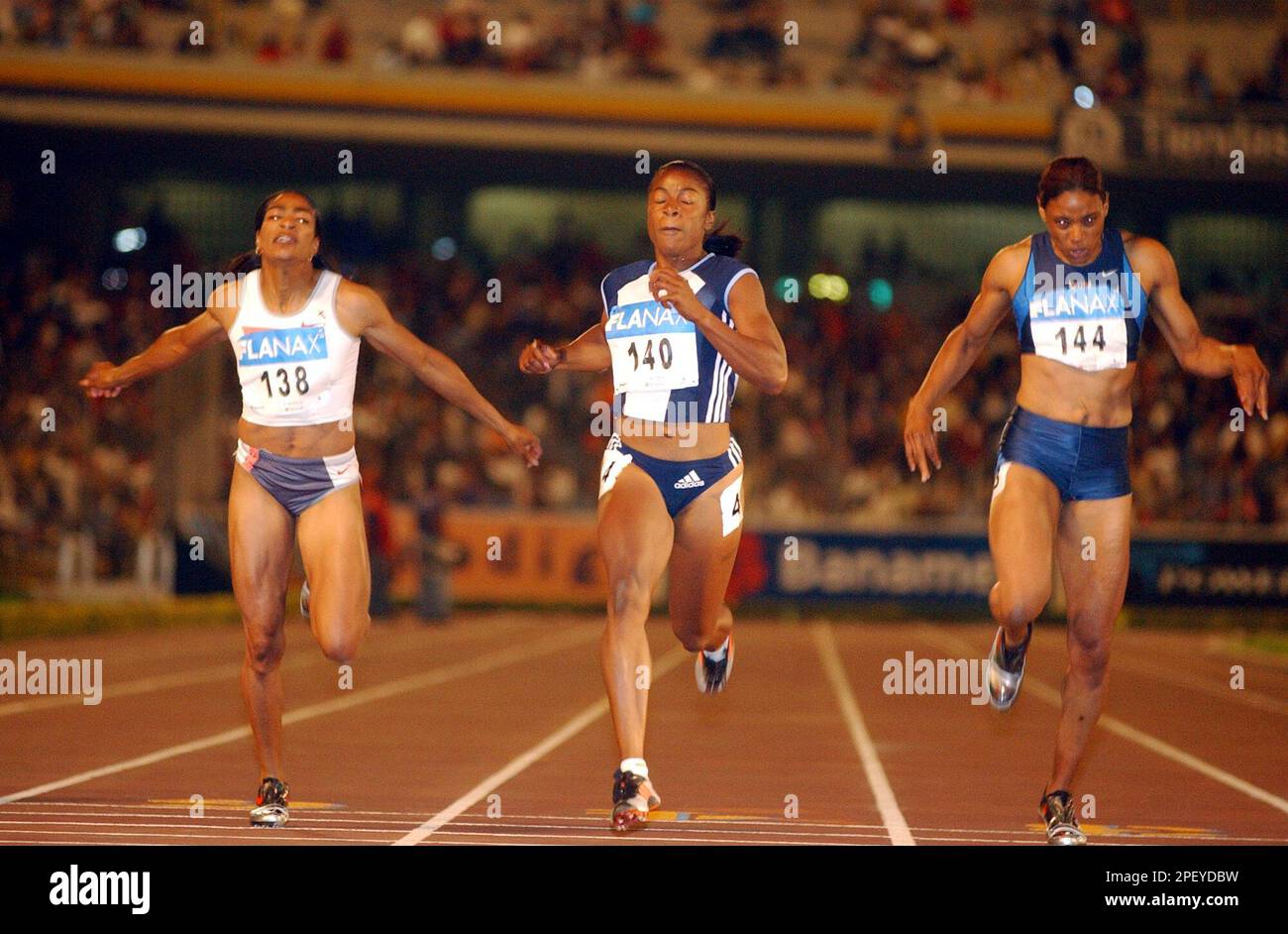 Debbie Ferguson, 140, crosses the final line of the 200 meter as ...