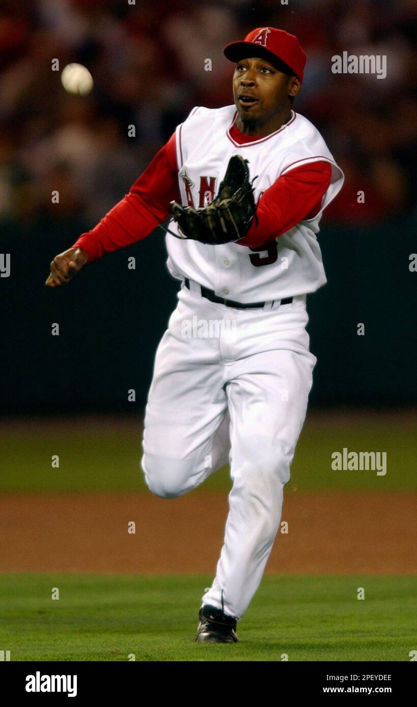Anaheim Angels third baseman Chone Figgins chases down an infield hit ...