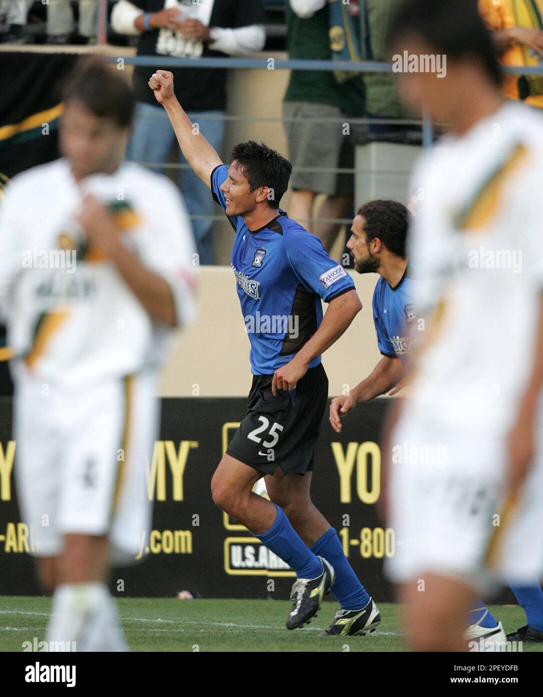 San Jose Earthquakes' Brian Ching, center, celebrates after scoring a ...