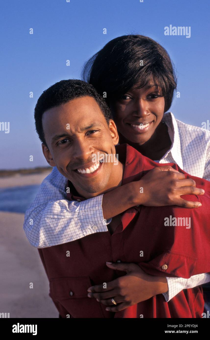 Romantic african-American couple having fun in the summertime on the ...