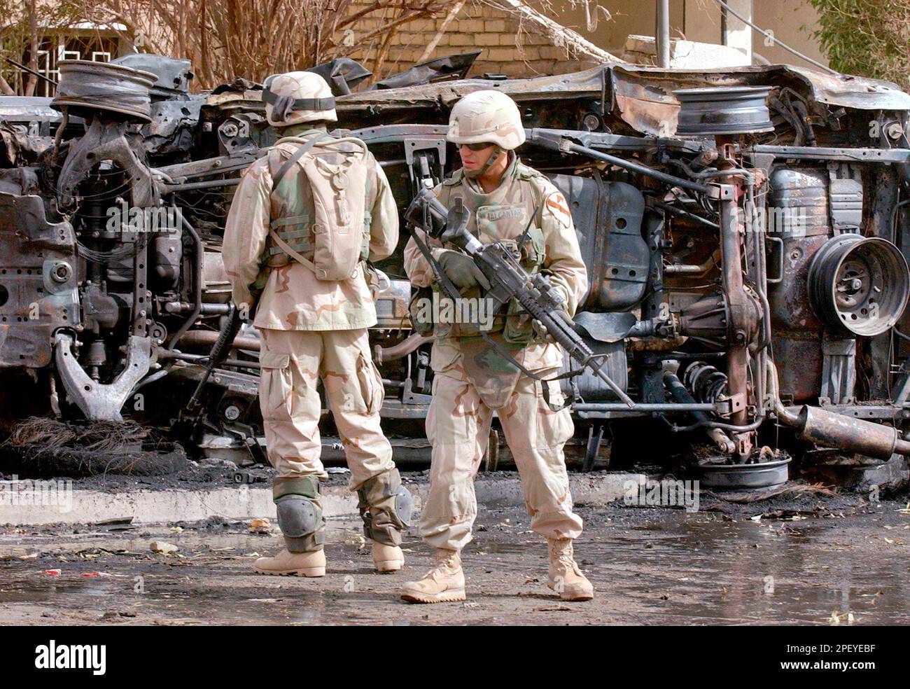 U.S Army soldiers secure the area where a car bomb exploded in Baghdad ...