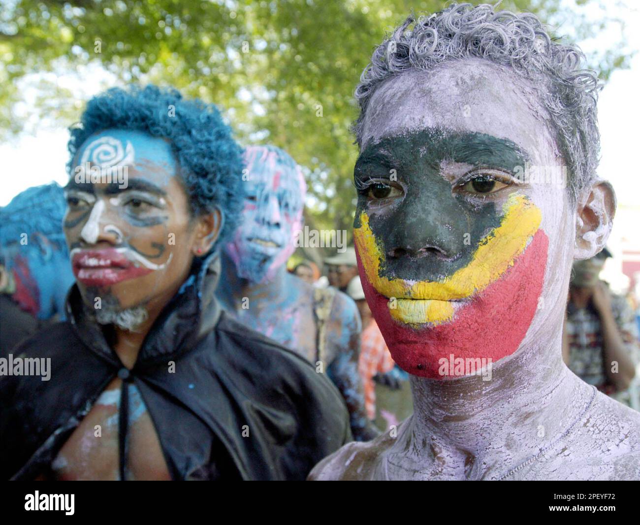 East Timor art students painted with body paint go through the streets ...
