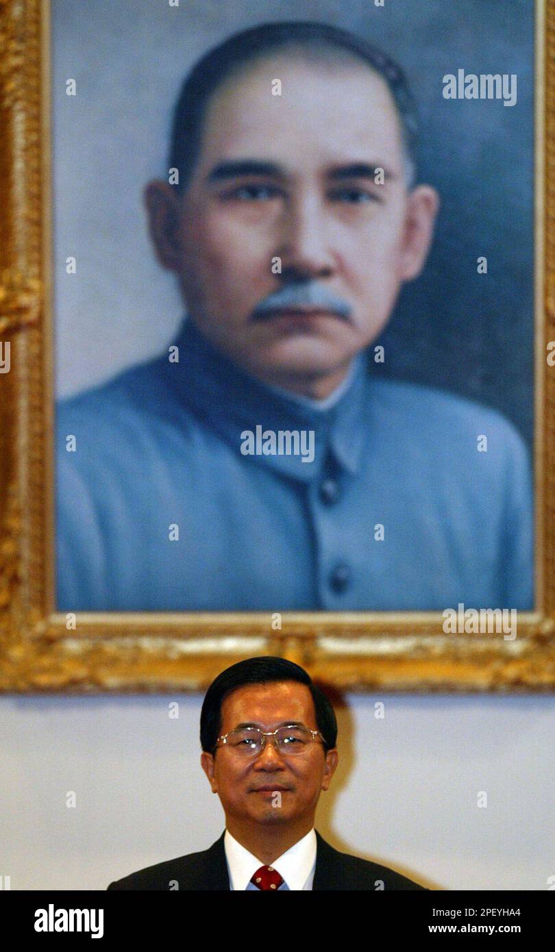 Taiwanese President Chen Shui-bian stands in front of a portrait of Sun ...