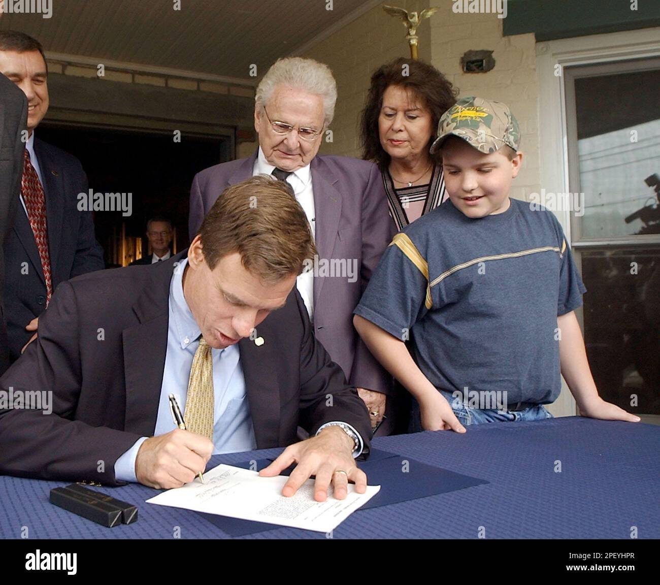 Virginia Gov. Mark Warner signs House Bill 909, sponsored by Delegate ...