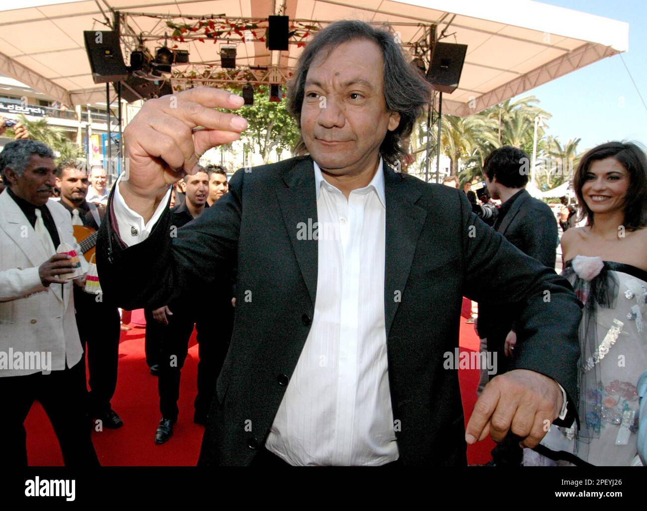 French director Tony Gatlif dances as he arrives at the festival palace ...