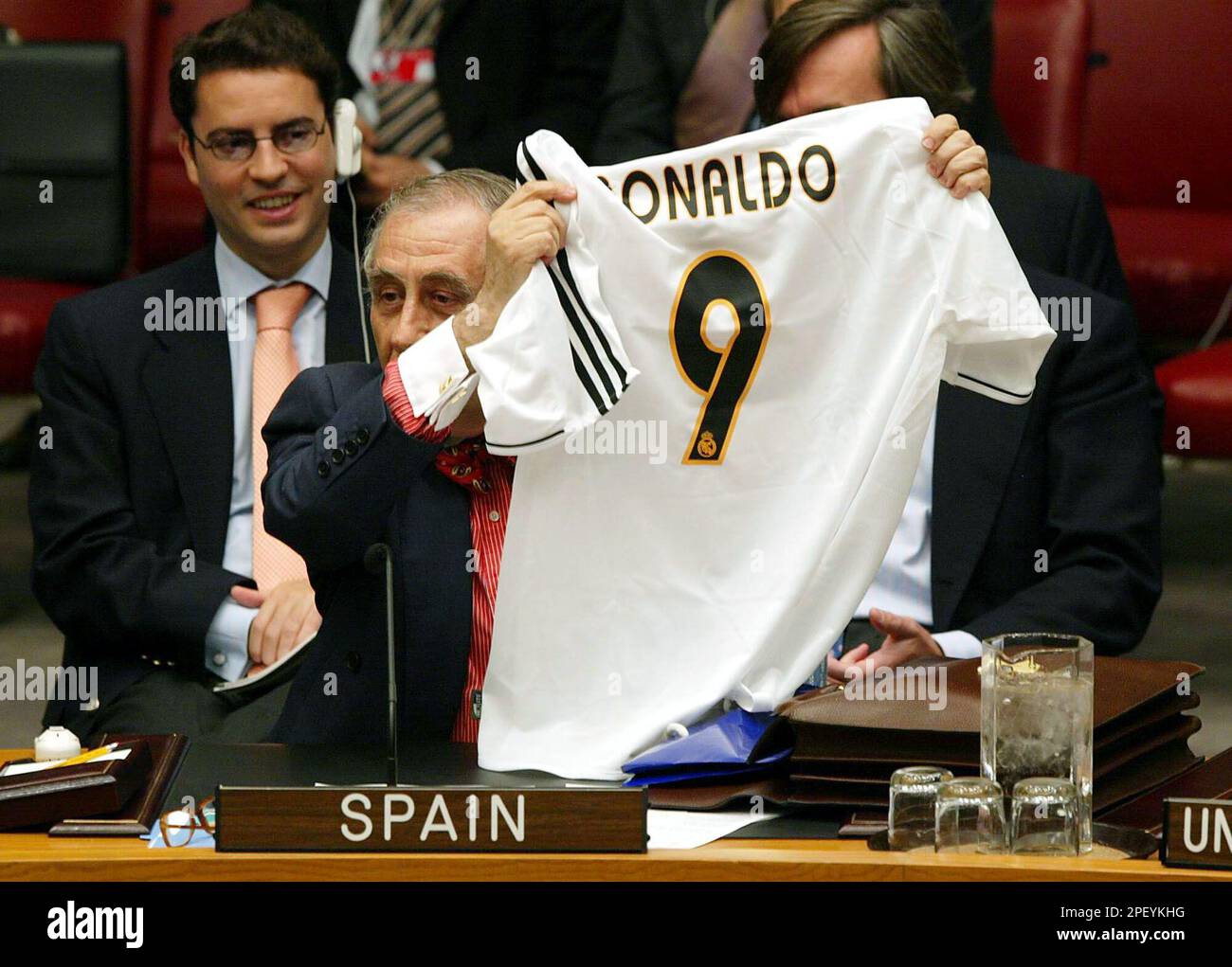 Spanish Ambassador Inocencio Arias shows a shirt of Real Madrid soccer ...