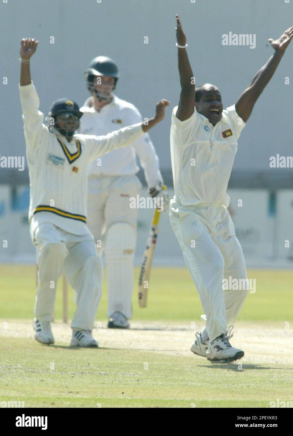 Sri Lankan bowler Sanath Jayasuriya, right, and Sri Lankan fielder ...