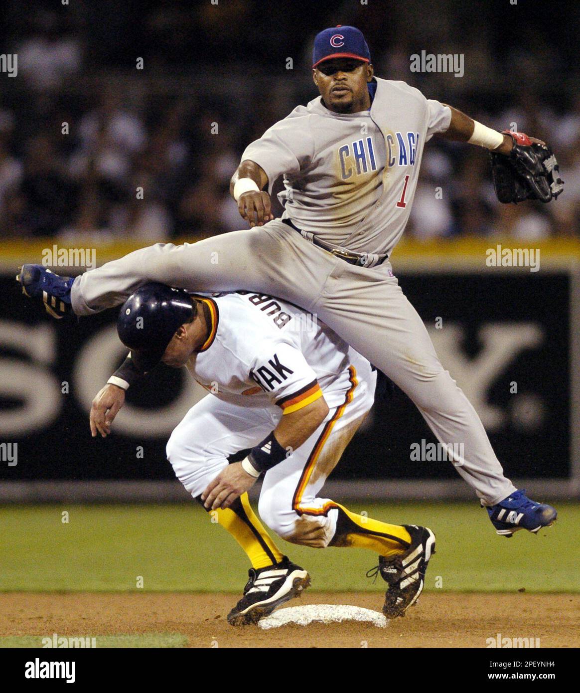 Chicago Cubs second baseman Jose Macias goes over the top of San Diego ...