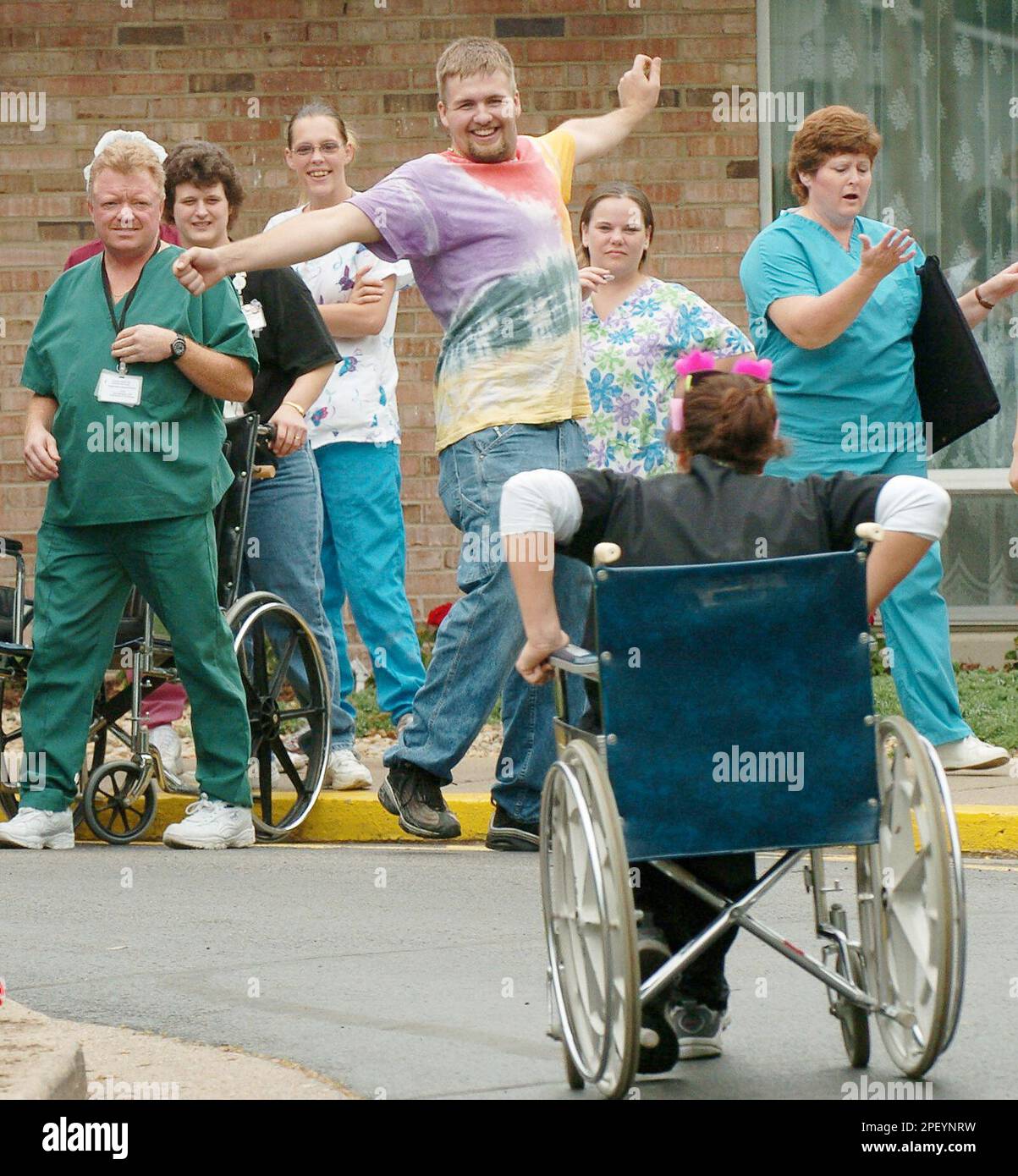 Larry Sweet Jr., top center, cheers for Erin Vance, bottom, as she ...