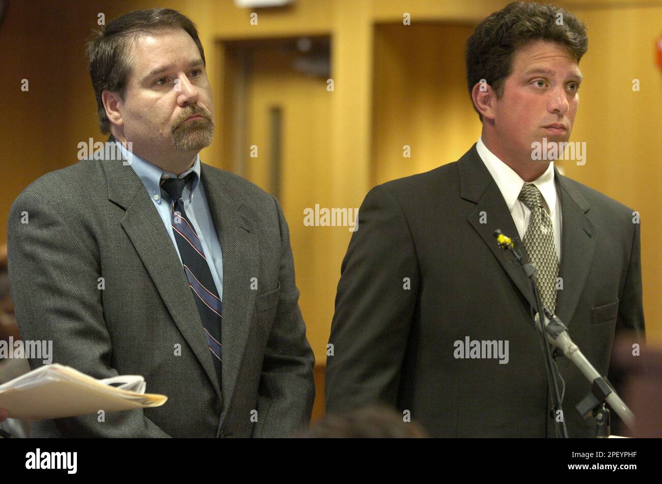 Brett Cashman, left, and John T. Price listen to Judge James Chylinski ...