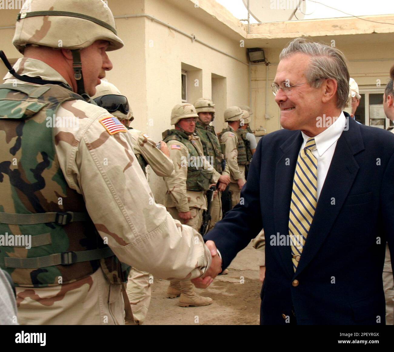 U.S. Defense Secretary Donald Rumsfeld meets military personnel at the ...