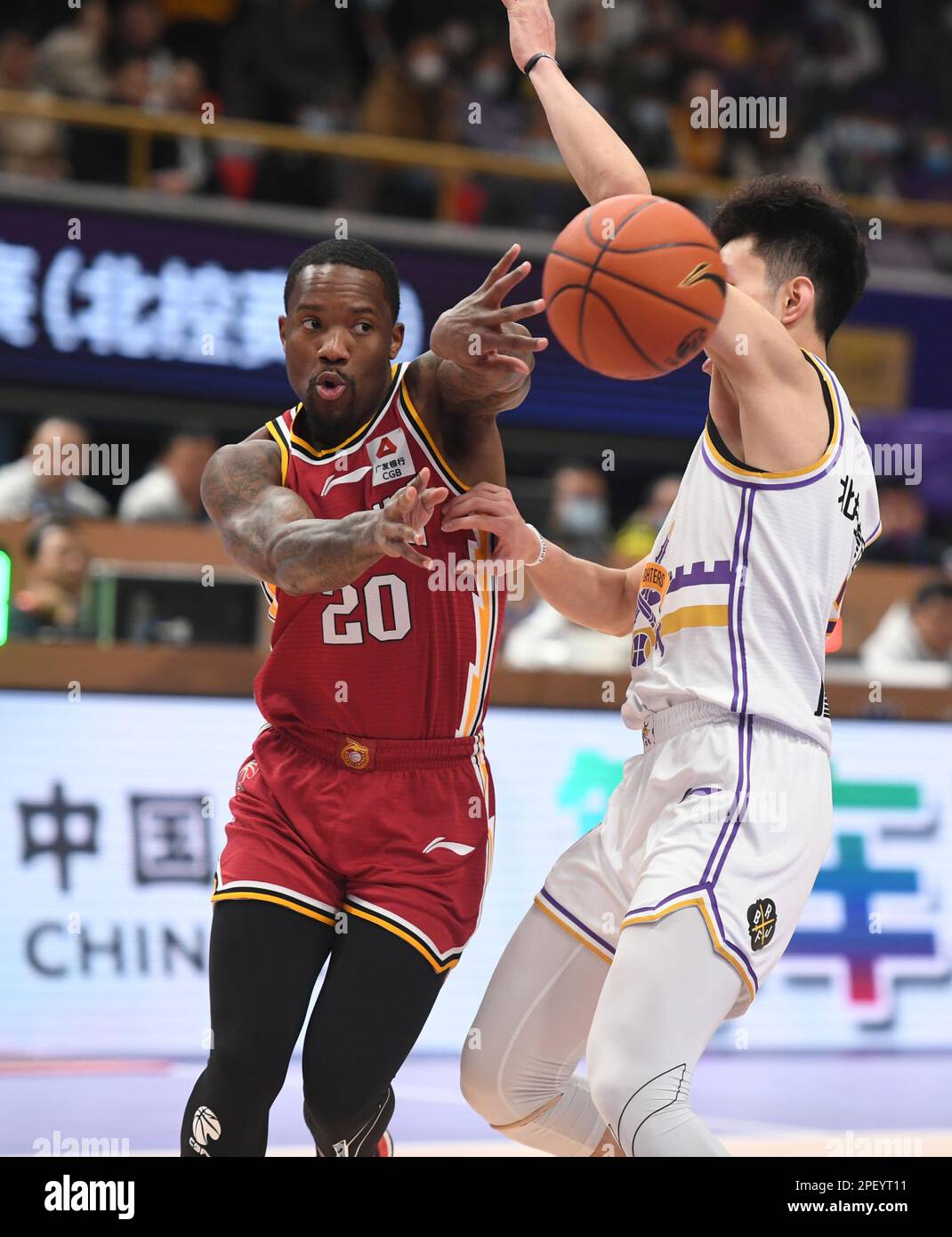 Beijing, China. 16th Mar, 2023. Kay Felder (L) of Shanxi Loongs passes ...