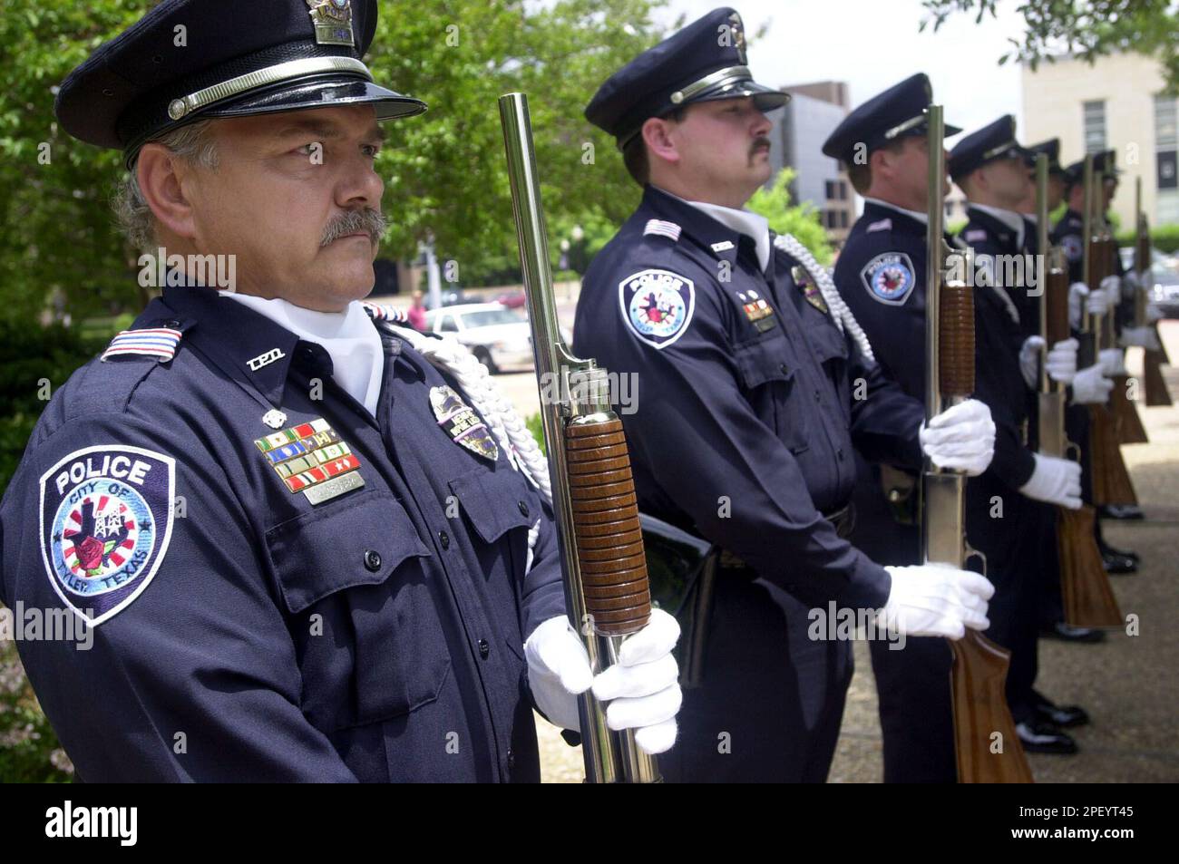 Officer Allan Crosby, front, and other members of the Tyler, Texas ...