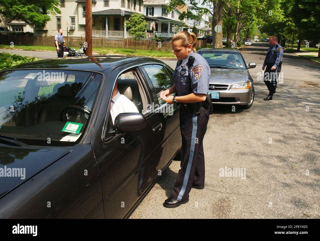 Haddonfield Police Officer Danielle Grasso, center, collects driving ...