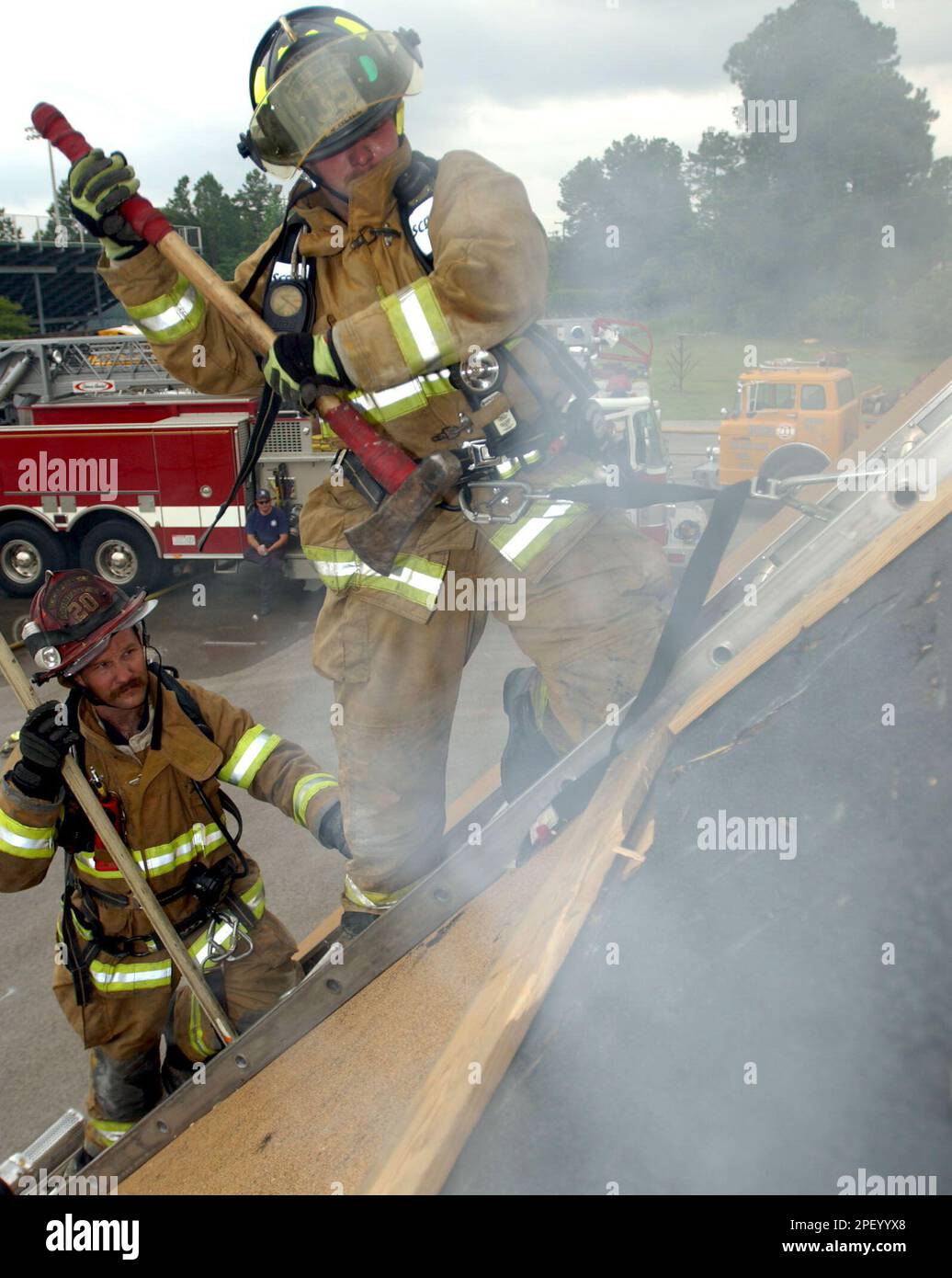 Firefighter Jeremy O'Neill, top, and Capt. Greg Mathis, both of the ...