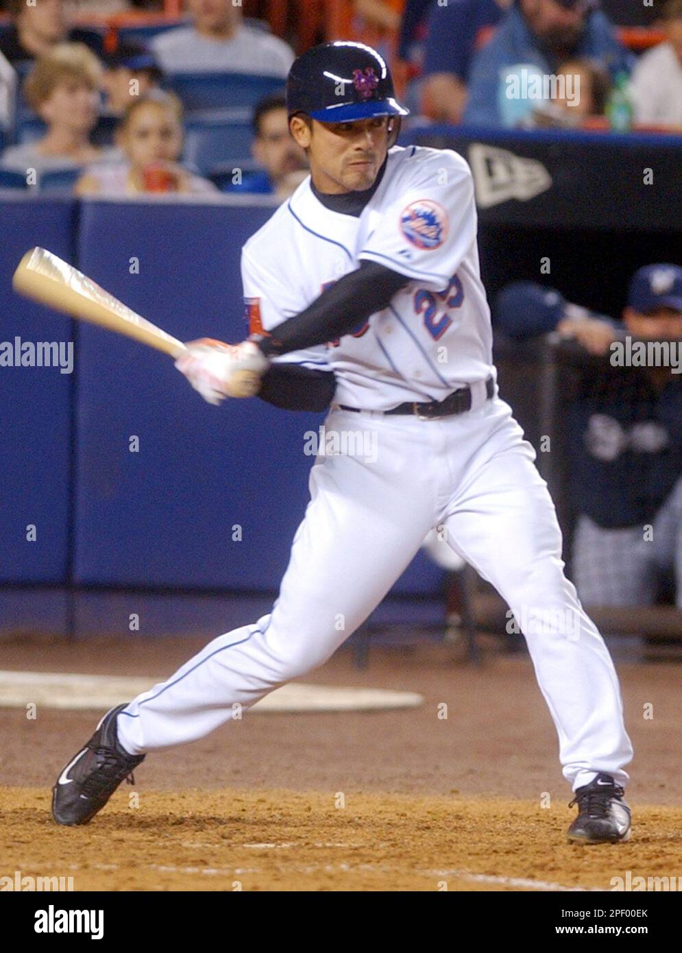 New York Mets' Kazuo Matsui follows through on a single during the ...