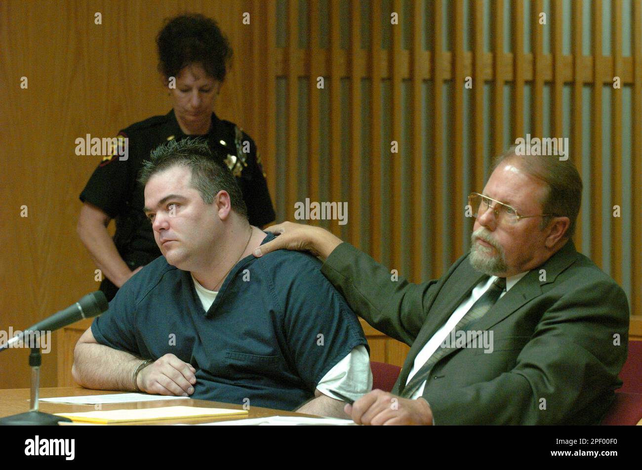 Joseph Robert Teitgen, left, sits with his lawyer, Stephen Krimel, and ...