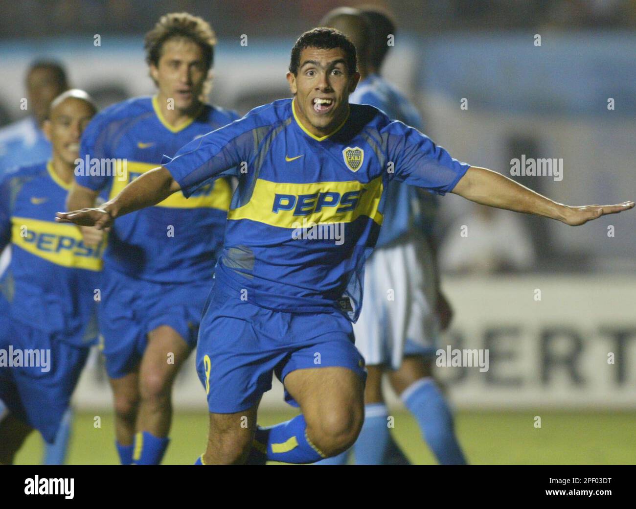 Soccer player Carlos Tevez of Boca Juniors, celebrates his goal against ...