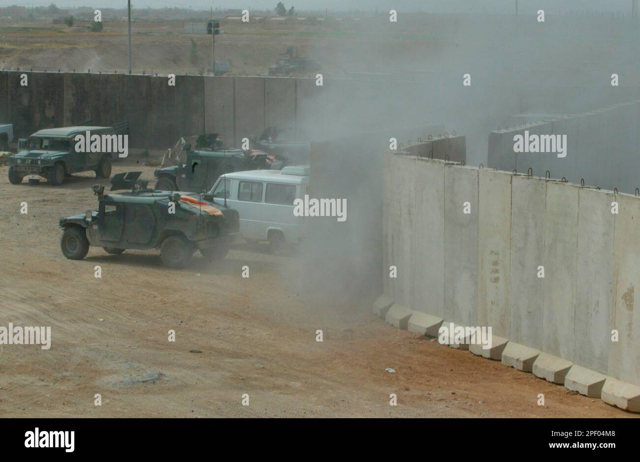 Smoke rises after a mortar round lands inside camp Golf, a US army base ...