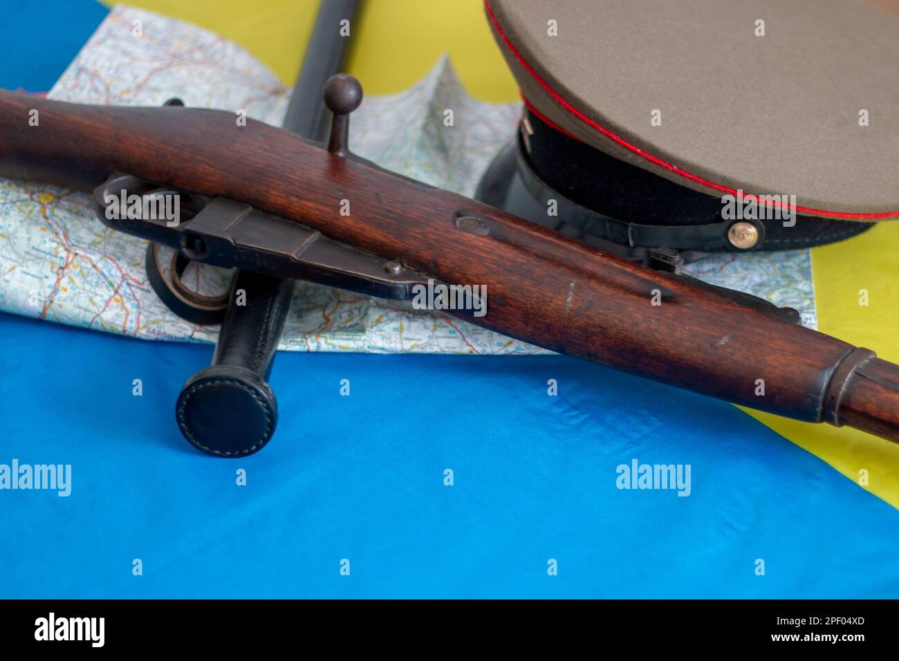 Ukraine flag with different military objects such as a rifle, a Russian ...