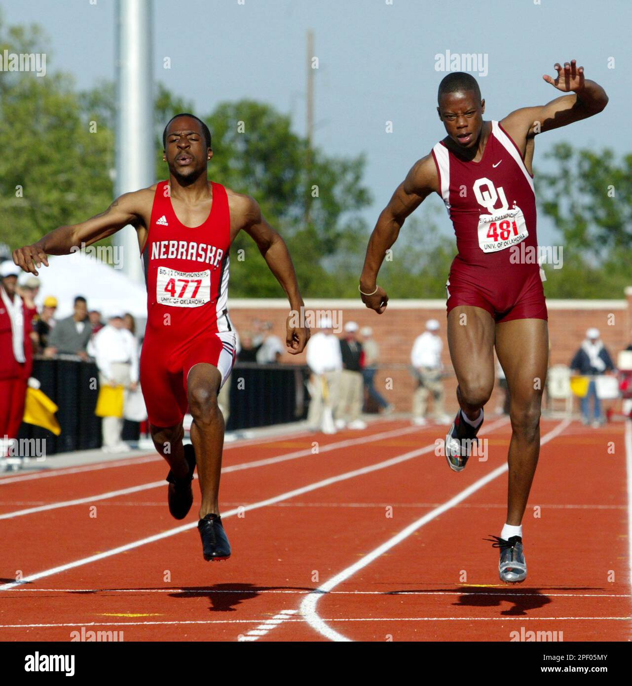 Oklahoma's DaBryan Blanton, right, wins the men's 100-meter dash ahead ...