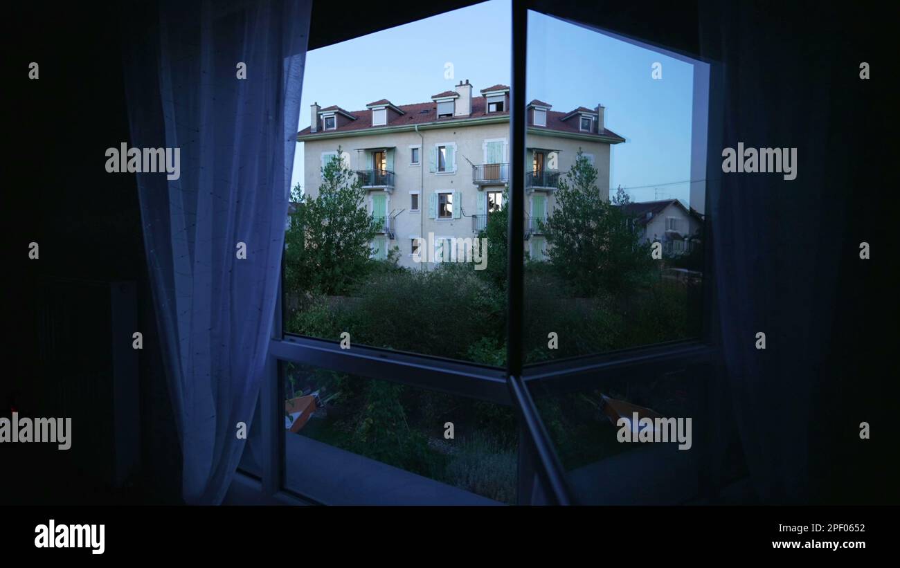 Apartment window glass reflections during sunset twilight hour indoors ...