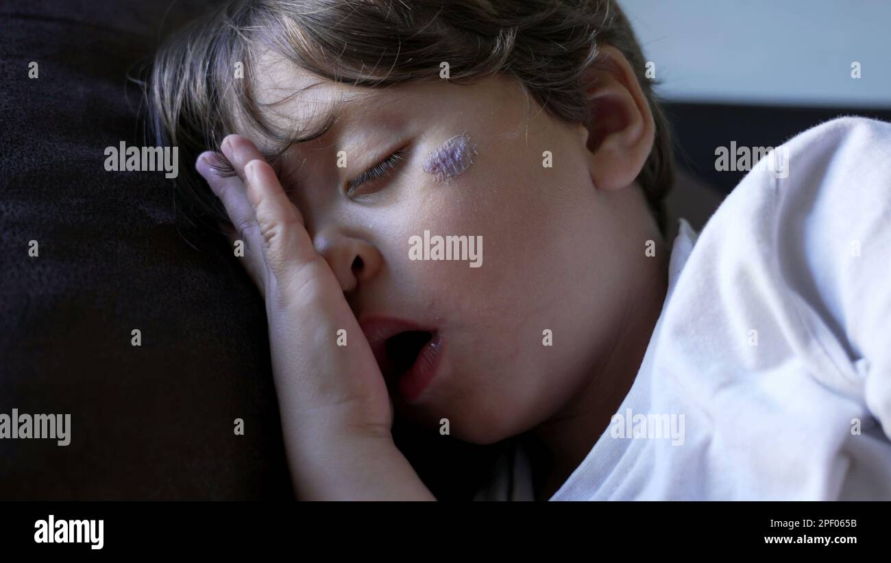Adorable child asleep during afternoon nap. Closeup face of tired small ...