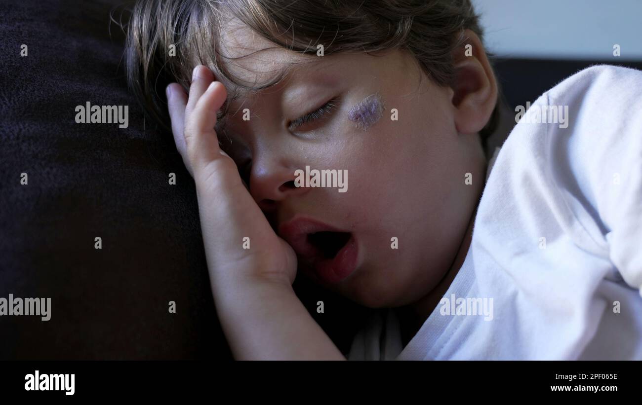 Adorable child asleep during afternoon nap. Closeup face of tired small ...