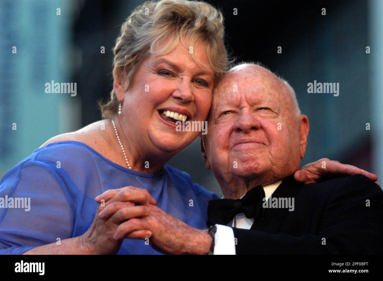 Jan, left, and Mickey Rooney pose for photographs after having unveiled ...
