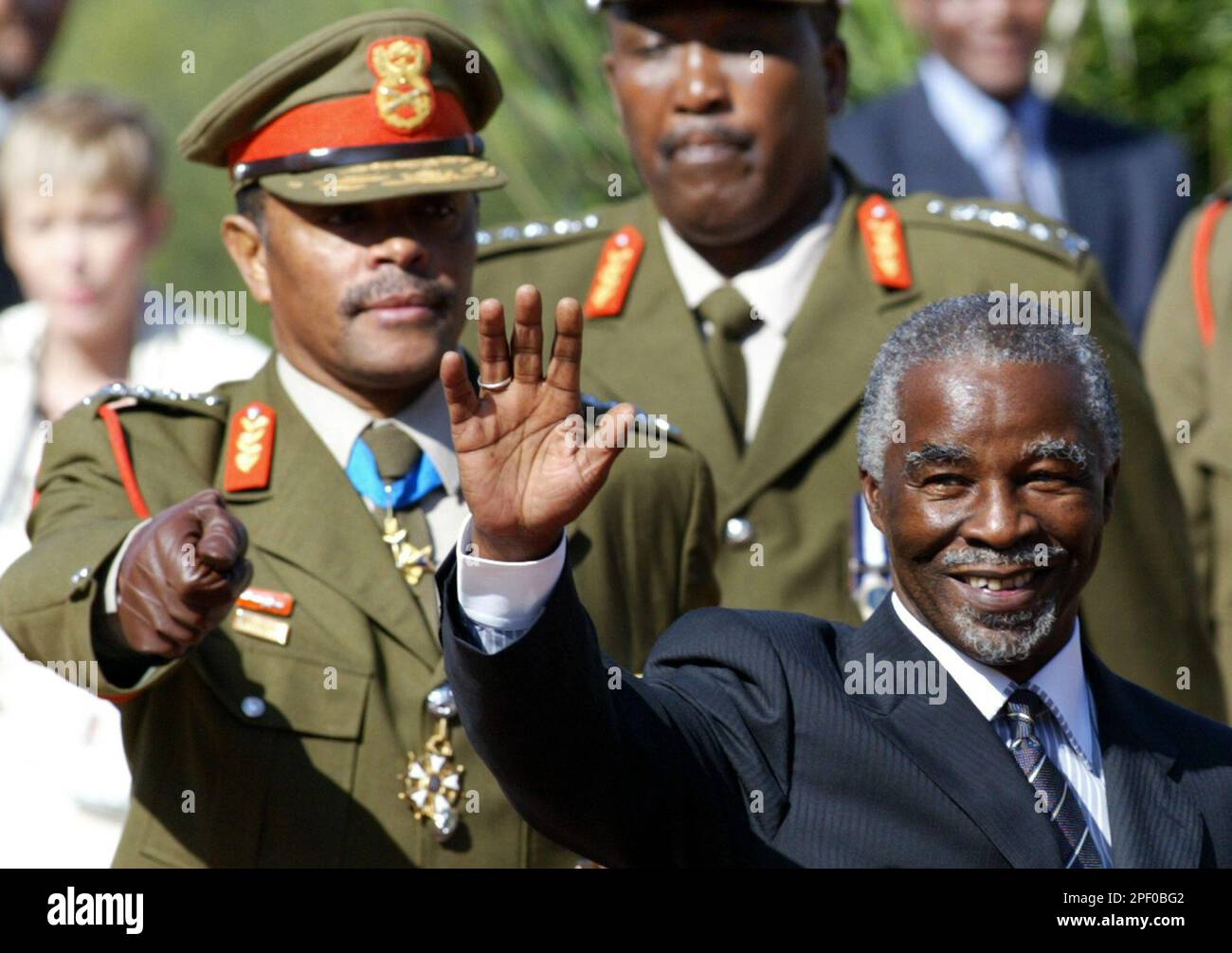 South African President Thabo Mbeki salutes the crowd after being sworn ...