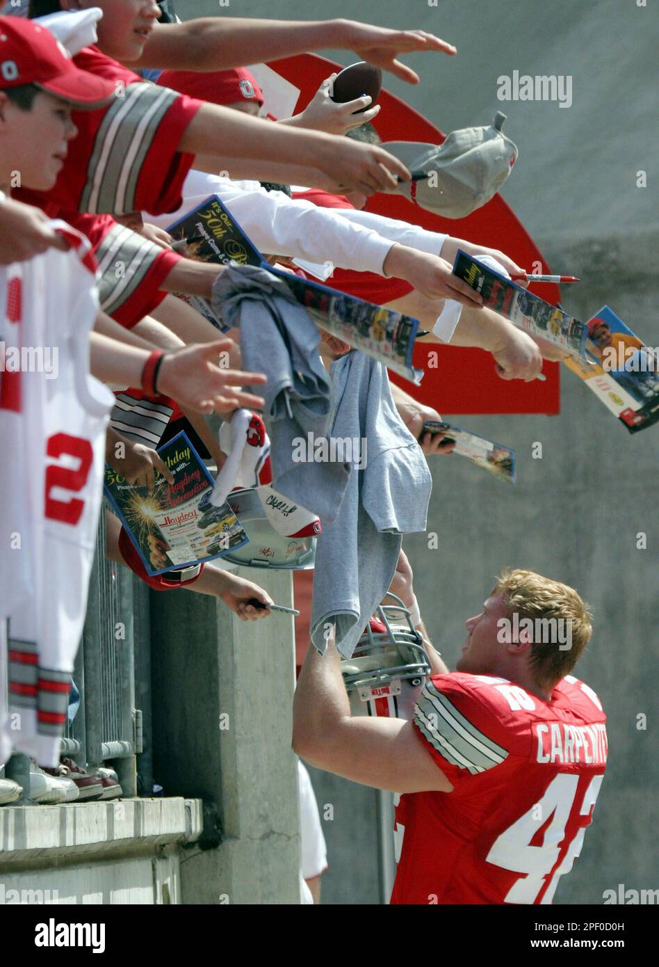 Ohio State linebacker Bobby Carpenter (42) signs autographs for fans ...