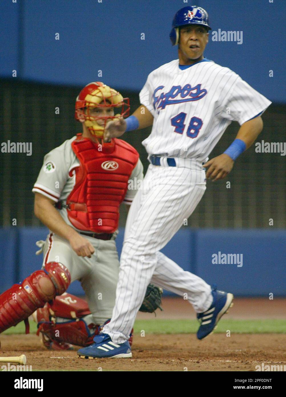 Montreal Expos' Termel Sledge scores past Philadelphia Phillies catcher ...