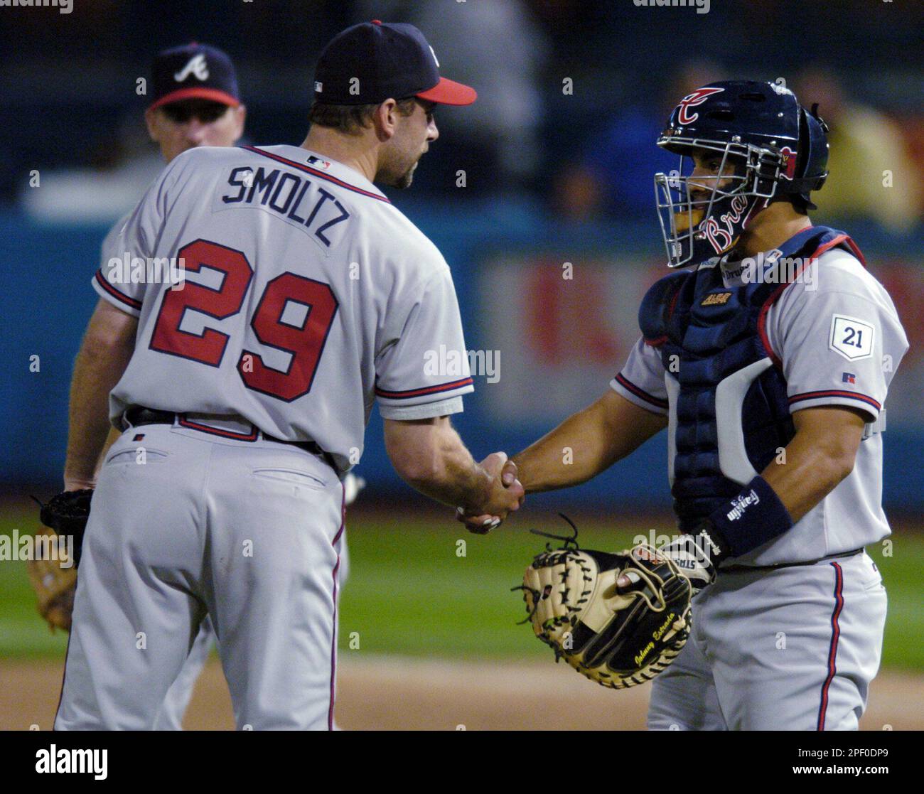 Atlanta Braves relief pitcher John Smoltz, left, shakes hand with ...