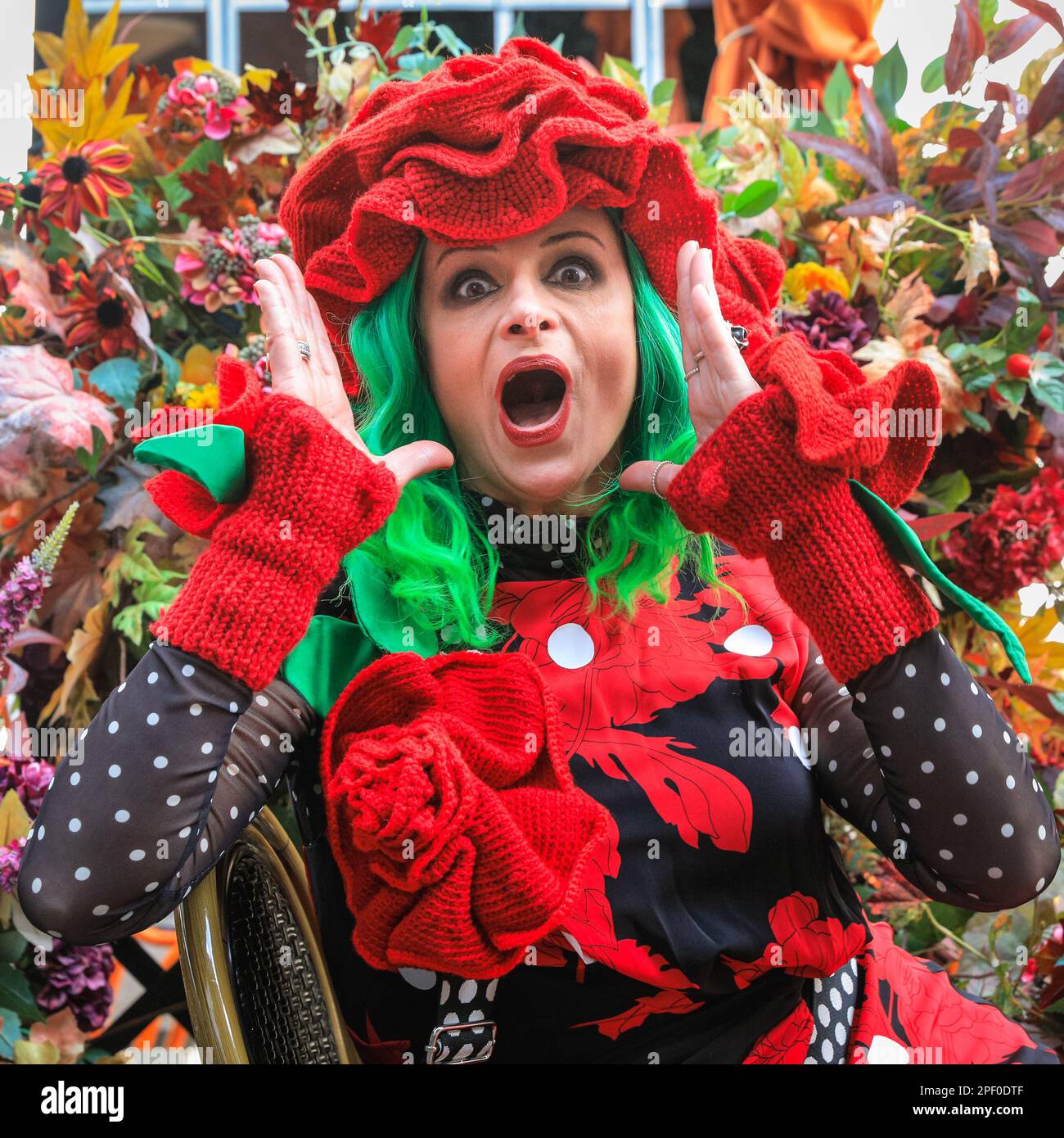 London, UK. 15th Mar, 2023. A participant in hand-crocheted hat poses ...