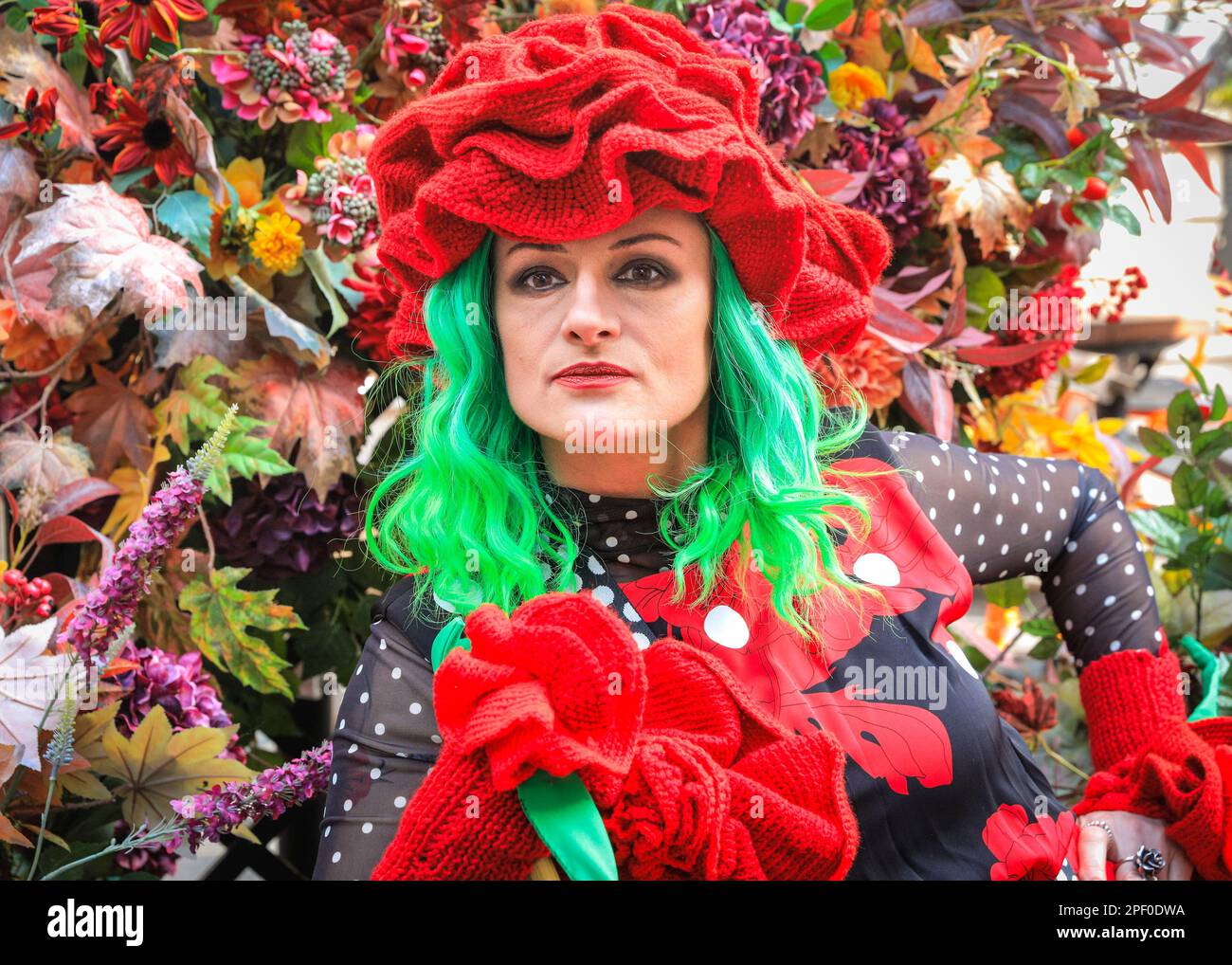 London, UK. 15th Mar, 2023. A participant in hand-crocheted hat poses ...